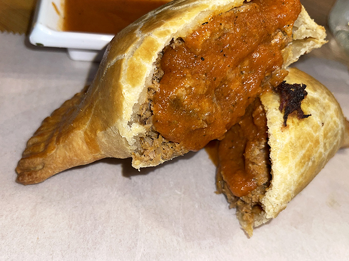 Cut into an empanada and watch the steam escape like a delicious sigh. Flaky exterior gives way to a savory filling that tastes like someone's grandmother made it.