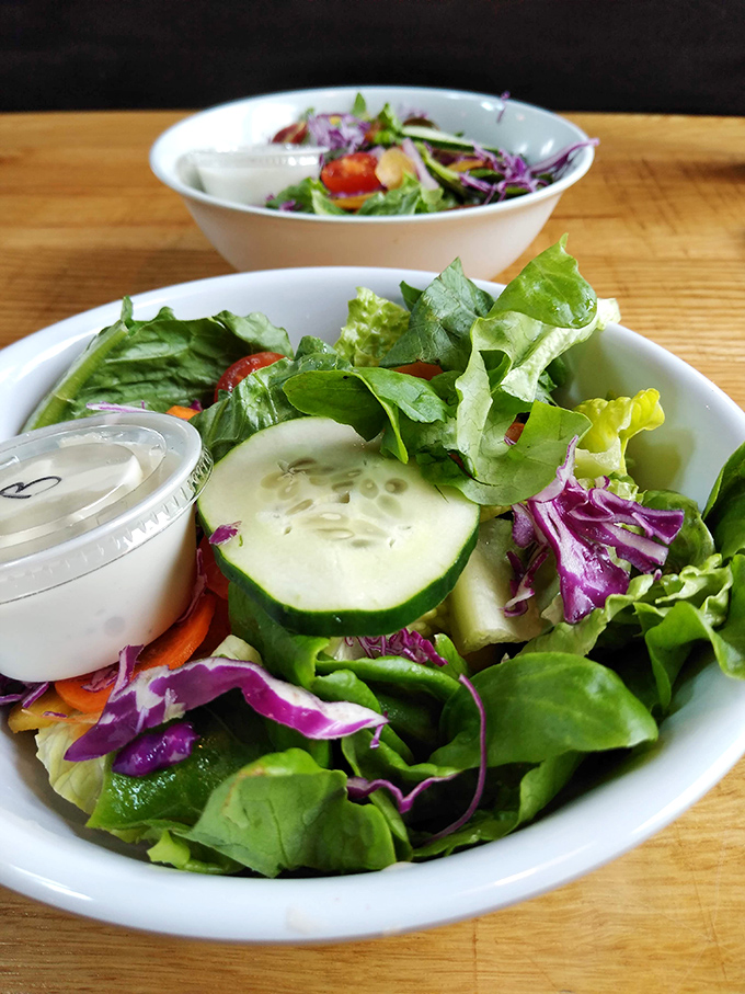 Fresh, vibrant salads prove that vegetables can party too, with crisp greens, purple cabbage, and cucumber slices dancing in homemade dressing.
