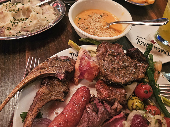 A plate that tells the story of Brazil through meat. Lamb chops, sausage, and perfectly charred cuts create a carnivore's dream team.