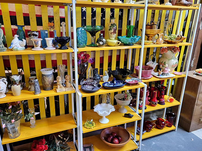 Bright yellow shelves showcase a rainbow of vintage glassware and ceramics&mdash;your grandmother's prized possessions, now waiting for new homes.