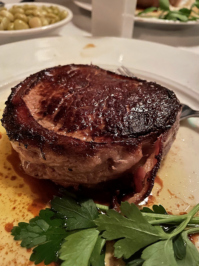 The filet mignon at Pat's doesn't just melt in your mouth&mdash;it practically signs a lease and moves in. Note the textbook crust and rosy interior.