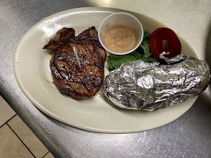 This filet mignon isn't just cooked&mdash;it's been treated with the reverence of a sacred artifact, complete with ceremonial baked potato in foil.