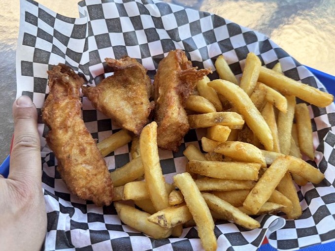 Golden, crispy fish and chips served in checkered paper&mdash;comfort food that understands its assignment perfectly.