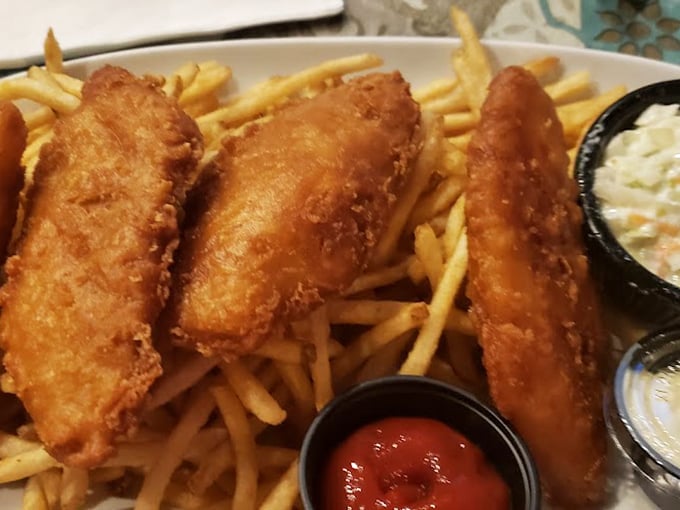 Fish and chips so perfectly battered they deserve an award. The golden-brown coating shatters with each bite, revealing tender, flaky perfection beneath.