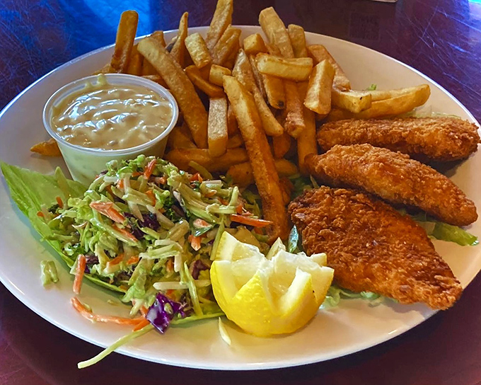 Fish and chips that would make a British pub jealous, with coleslaw that actually deserves its place on the plate.