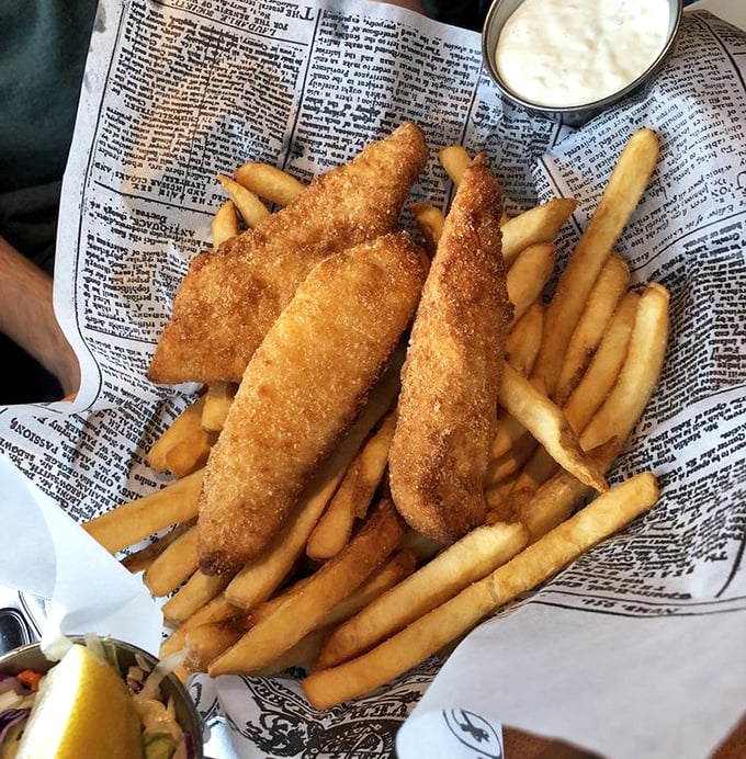 Golden-battered fish and chips served on newspaper&mdash;a delicious reminder that sometimes the simplest presentations deliver the most profound flavors.
