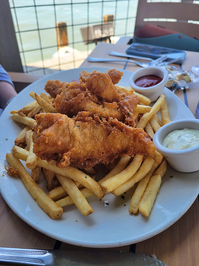 Golden fried fish and chips that would make any British pub weep with envy over this Texas perfection.