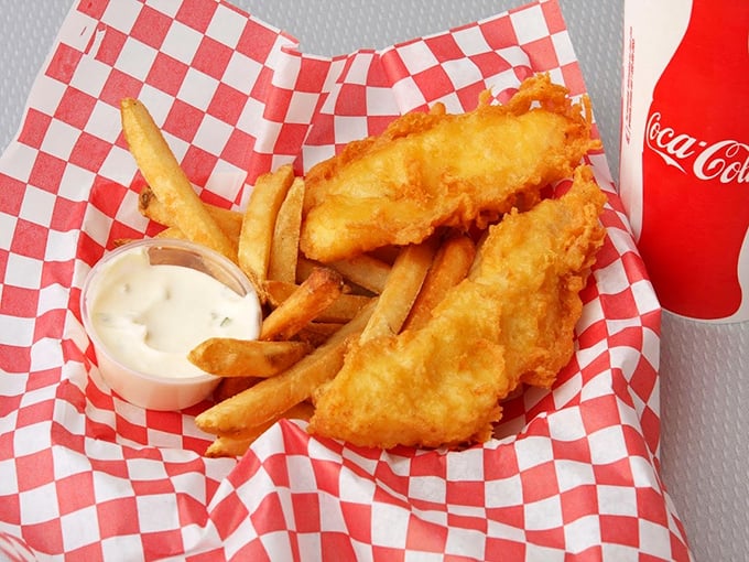 Fish and chips that would make a British pub nervous about its reputation, served with a side of tartar sauce that means business.