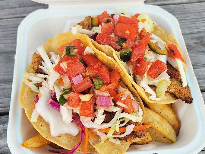 Behold the star of the show! Fresh fish nestled in soft tortillas with vibrant pico and cabbage&mdash;a flavor explosion that justifies the journey.