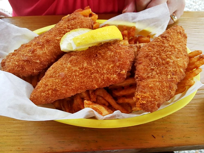 Golden-battered fish that would make Neptune himself swim to shore. Crispy on the outside, flaky within&mdash;seafood perfection without the white tablecloth pretense.