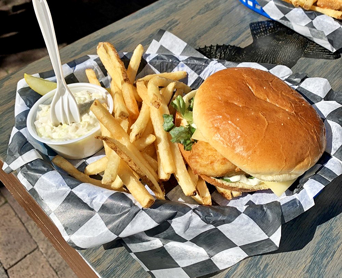 The whitefish sandwich&mdash;where brioche bun meets lightly fried Great Lakes treasure. A portable feast that makes you wonder why you'd ever settle for fast food again.