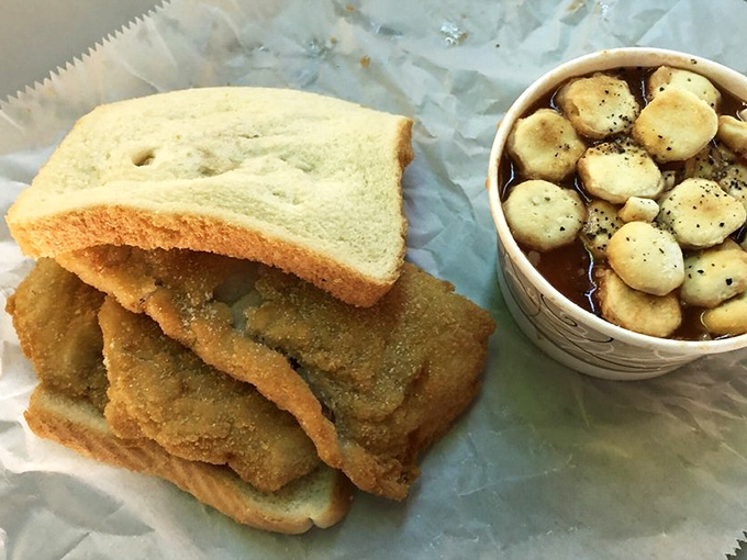 The legendary fish sandwich in all its glory - perfectly fried fish spilling over plain white bread. Simplicity that would make even the fanciest chef weep with joy.
