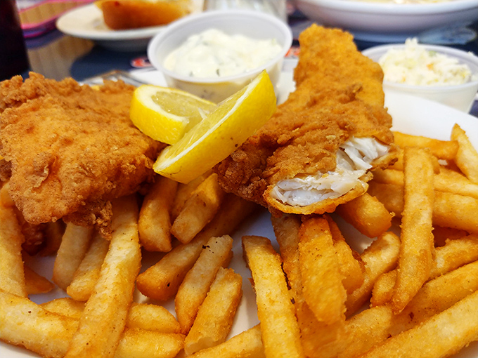 Golden-battered fish with perfectly crisp fries&mdash;the kind of plate that makes you forget about your diet faster than you can say "tartar sauce, please."