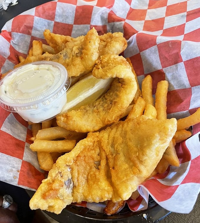 Fish and chips that would make a British pub regular weep with joy. The perfect golden ratio of crispy exterior to flaky, tender fish within.