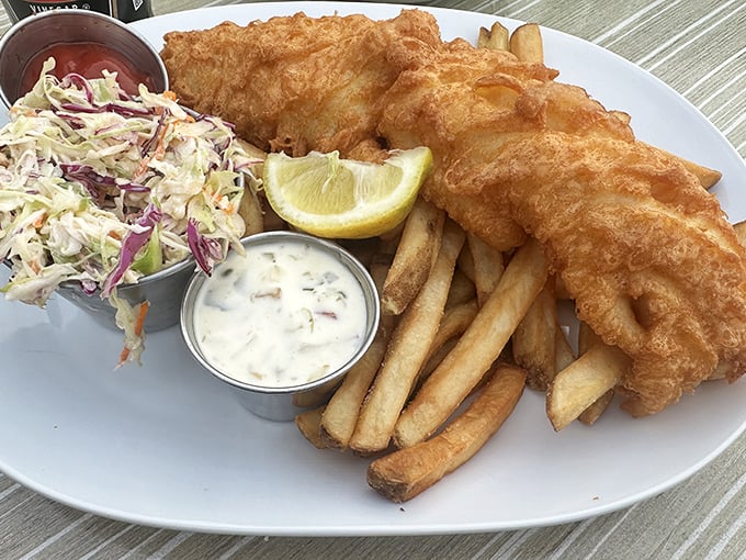 Fish and chips done right&mdash;golden-battered haddock with a crunch you can practically hear through the photo. That slaw isn't just a garnish, folks.