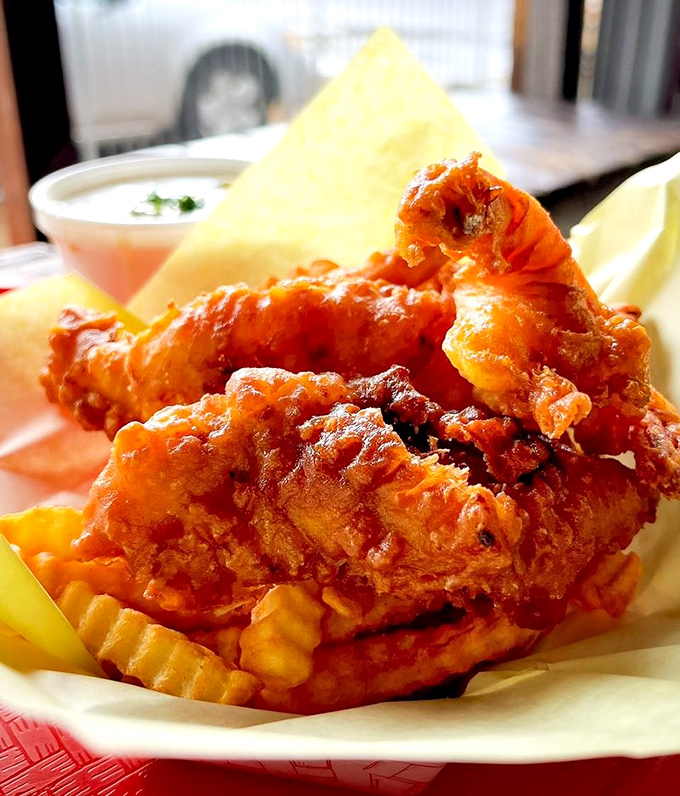 Golden-battered fish perched atop a mountain of fries&mdash;the kind of simple perfection that makes you wonder why you'd ever eat anything else.