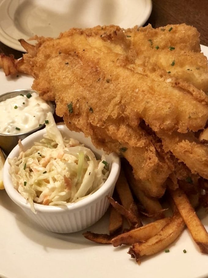 Golden-battered fish so crispy you can practically hear the crunch through the photo, served with the kind of fries that disappear mysteriously fast.