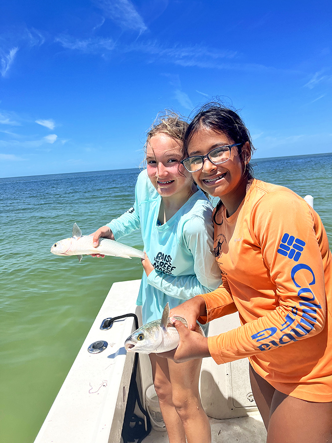 The universal joy of fishing knows no age limits. These young anglers proudly display their catch &ndash; memories being made one fish at a time.