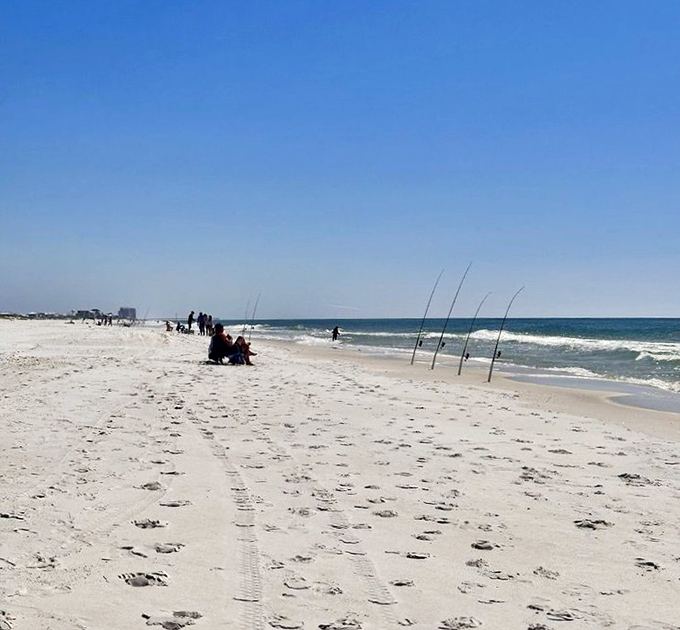 The patient fisherman's reward: uninterrupted horizon and possibility. Poles standing at attention like eager soldiers awaiting orders from the sea.