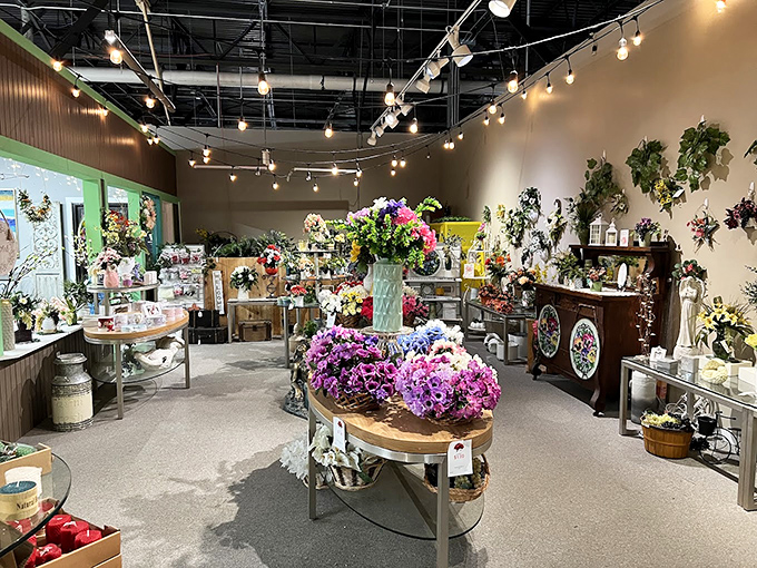 The flower shop blooms under string lights, creating an Instagram-worthy oasis where even those with black thumbs feel momentarily botanical.