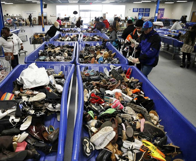 Shoe heaven or footwear purgatory? Hundreds of soles searching for their perfect match in this blue bin bonanza.