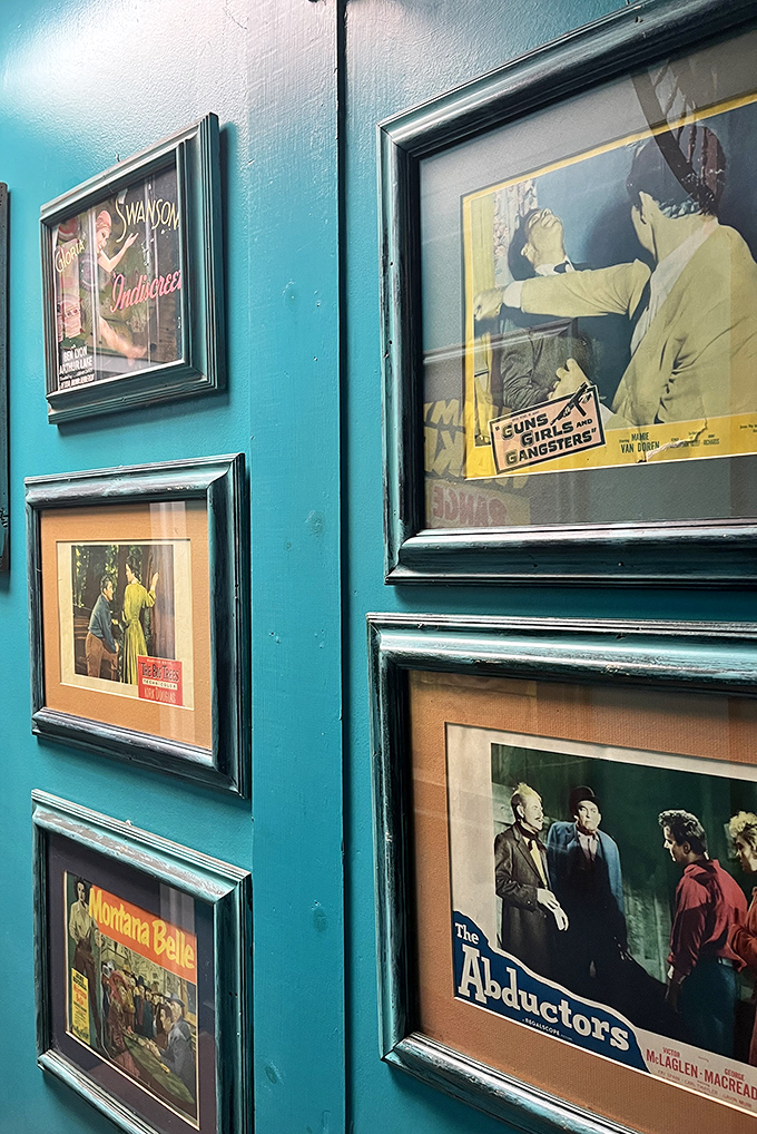 A teal wall gallery of vintage movie memorabilia &ndash; where Gloria Swanson and gangster flicks become conversation starters in your home.