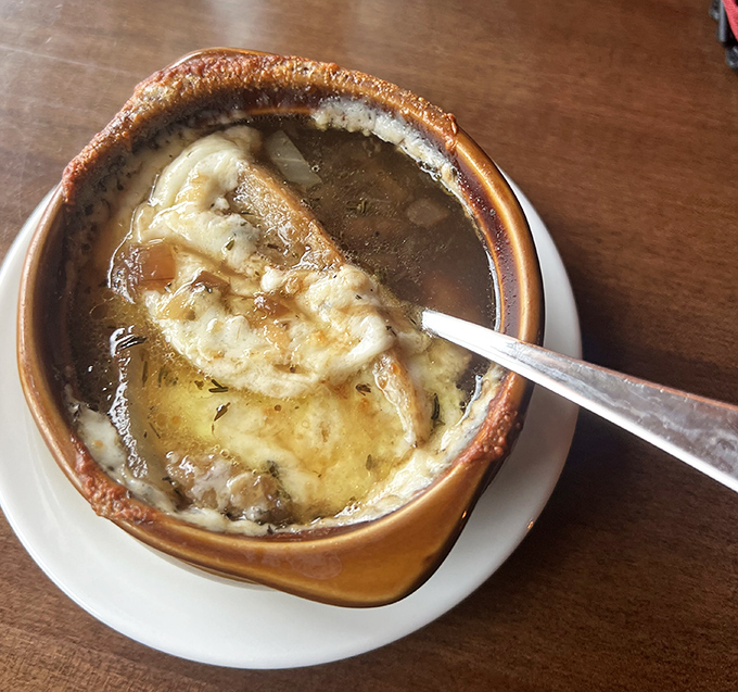 French onion soup bubbling away like a cheesy jacuzzi for your taste buds.