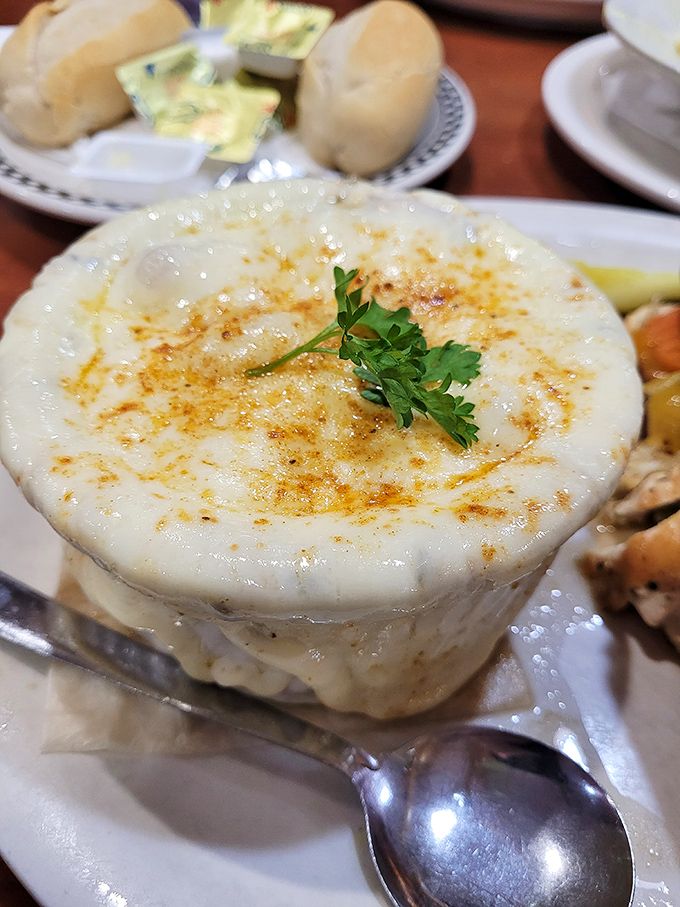 French onion soup with a cheese cap so perfect it deserves its own Instagram account. Spoon-breaking cheese pull guaranteed.