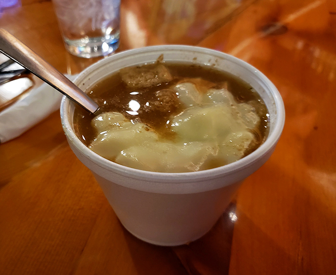French onion soup that doesn't just warm your body but hugs your soul, with that perfect cheese pull that deserves its own slow-motion sequence.