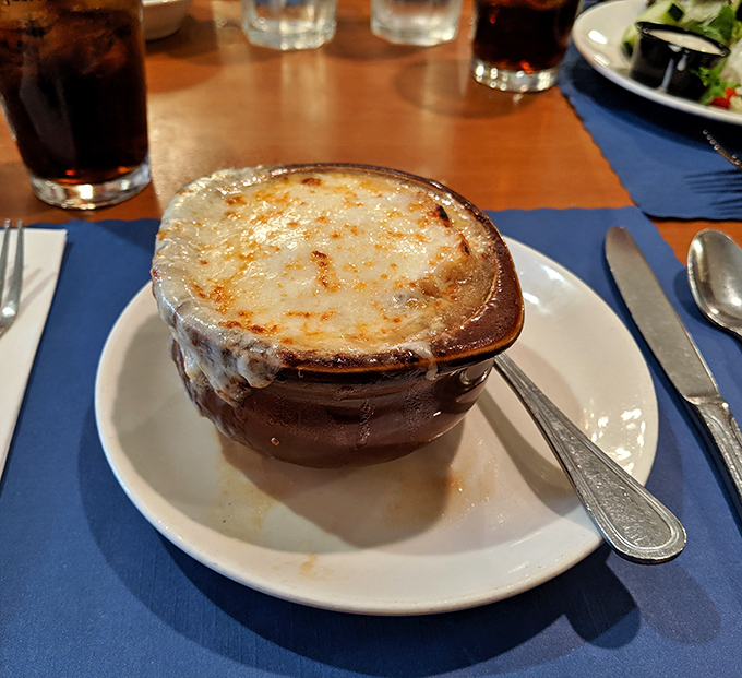 French onion soup that's achieved the perfect cheese-pull-to-broth ratio. The kind of dish that makes you want to write poetry or at least take a really good Instagram photo.
