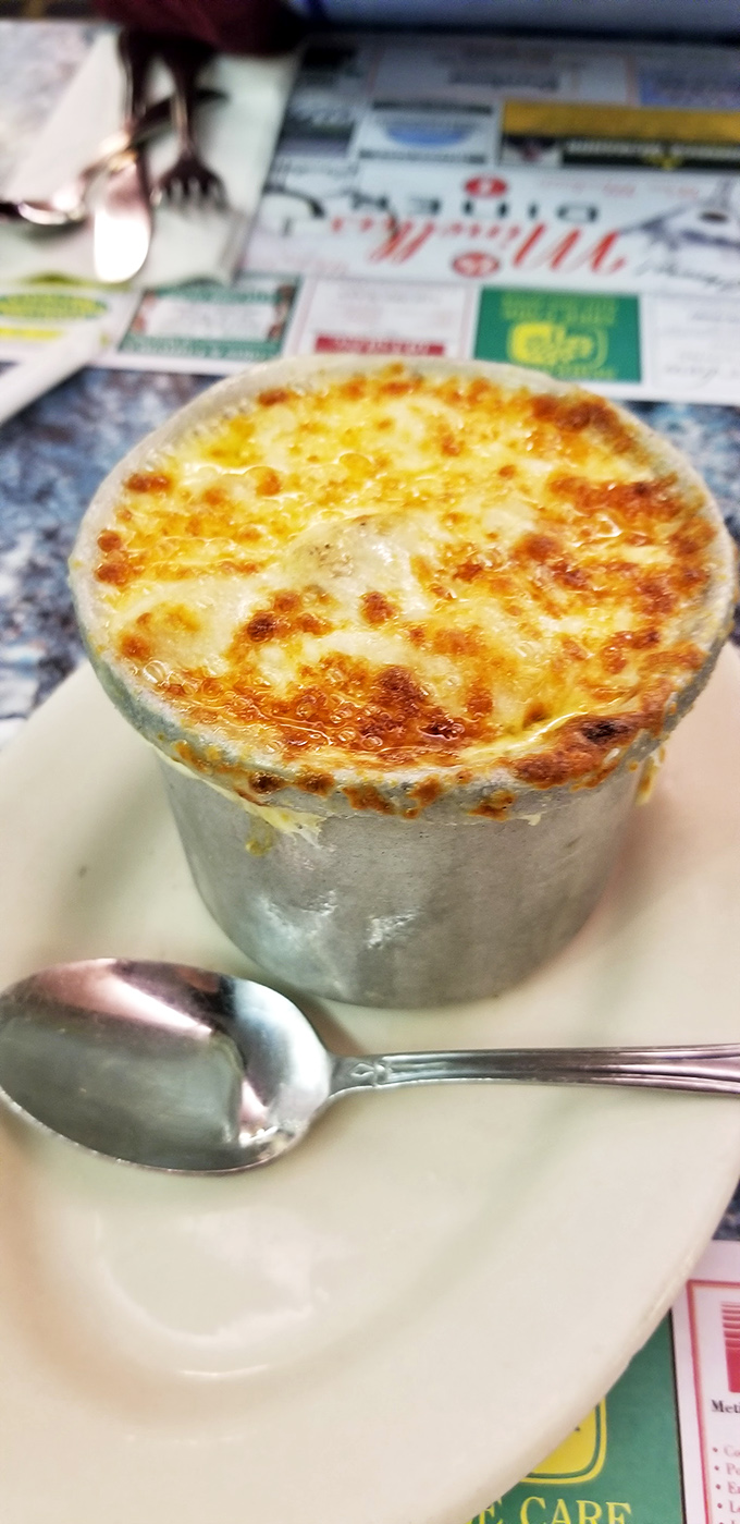 French onion soup that's achieved the perfect cheese-pull-to-broth ratio—the culinary equivalent of hitting the lottery on your first try.