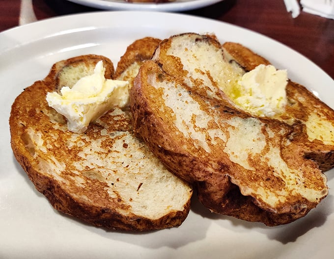French toast that makes you question every other French toast you've ever eaten. Thick-cut, golden-brown, and waiting for that butter to melt into every nook and cranny.