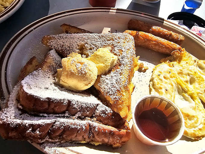 French toast that would make your grandmother jealous, served alongside eggs that somehow manage to be both fluffy and substantial.