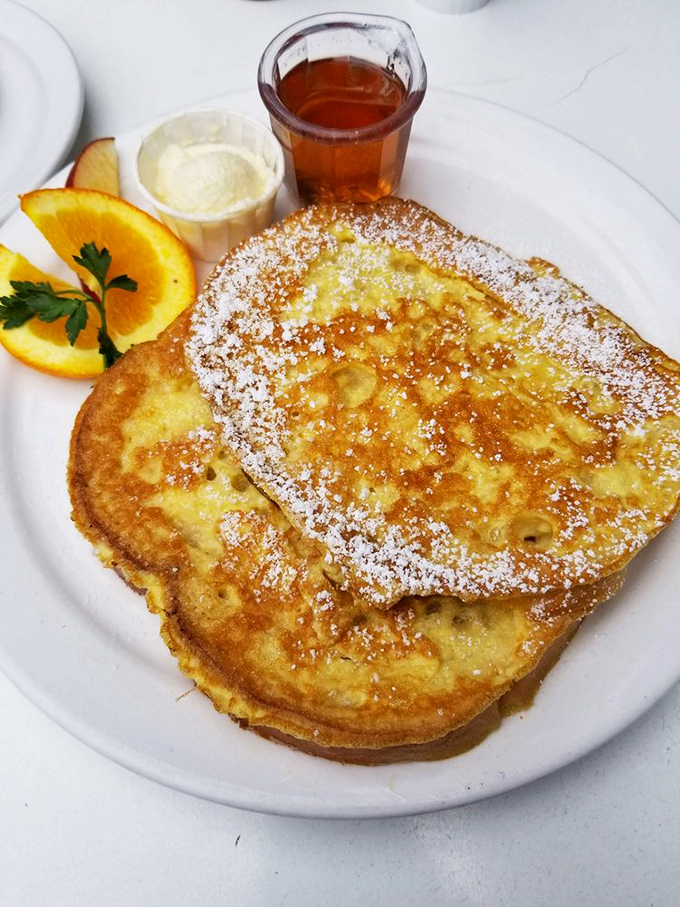 These Danish pancakes, dusted with powdered sugar and served with syrup, are what breakfast dreams are made of—thin enough for elegance, substantial enough for satisfaction.