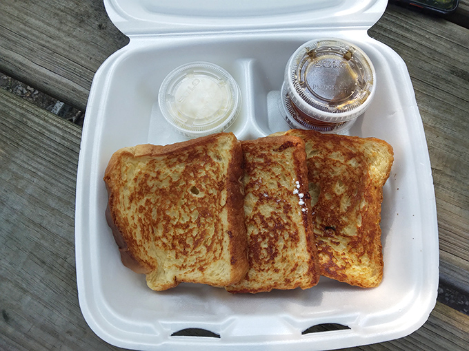 French toast to-go that somehow manages to maintain its dignity in a styrofoam container &ndash; the breakfast equivalent of formal wear at a casual event.
