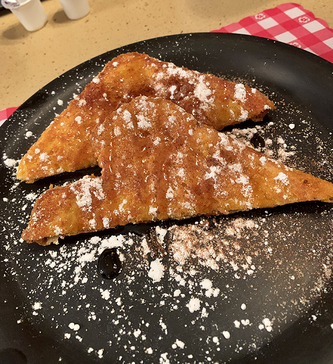 French toast that doesn't need a passport to impress. Dusted with powdered sugar like the first perfect snowfall of winter.