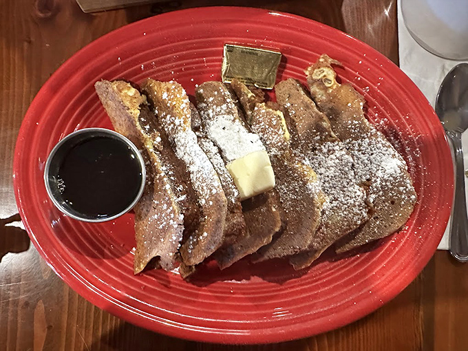 French toast that makes you question every other breakfast you've ever had. That powdered sugar dusting? Pure mountain snow magic.
