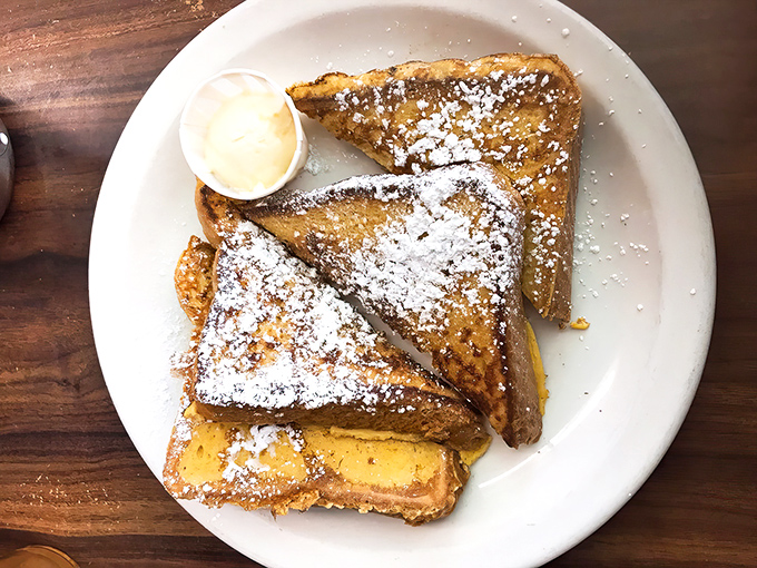 French toast that would make your grandmother nod in approval. Dusted with powdered sugar and served with a side of nostalgia that no trendy brunch spot can replicate.