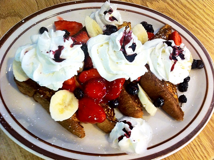 French toast that doesn't just break the fast&mdash;it celebrates it. Topped with fresh fruit, whipped cream, and berry sauce, it's breakfast masquerading as dessert.