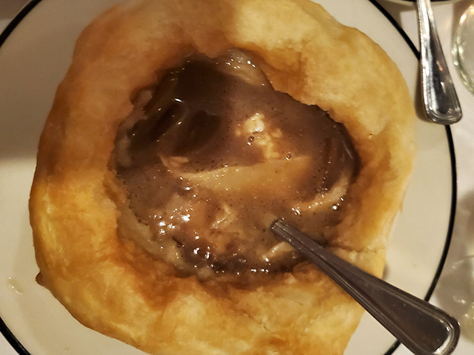 French onion soup bubbling under a golden cheese blanket&mdash;comfort food that knows exactly what it's doing here.