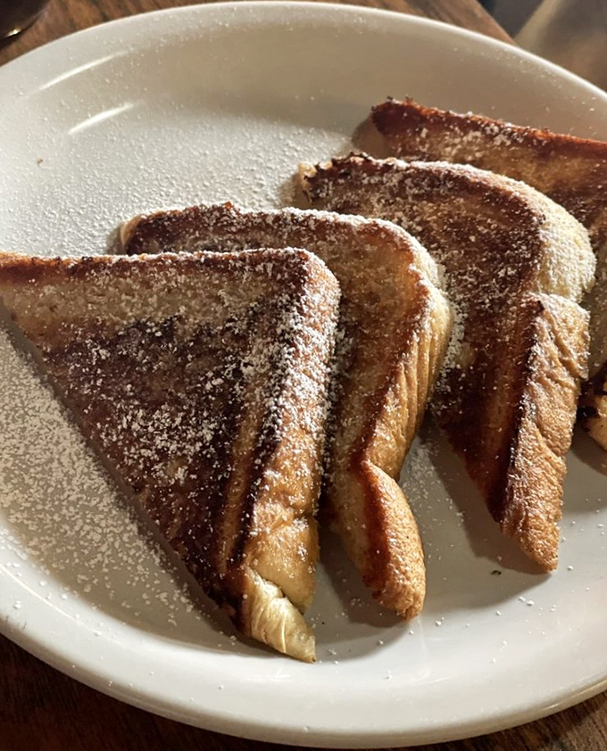 French toast that's achieved that mythical balance&mdash;crispy exterior, custardy interior, and a dusting of powdered sugar that would make Scarface jealous.