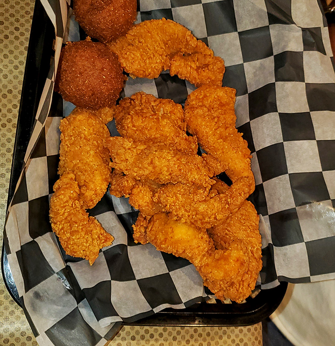 Fried catfish with a cornmeal crust so perfect it should have its own fan club. Crispy outside, tender inside&mdash;the Dolly Parton of seafood.