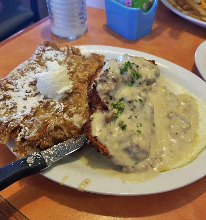 That French toast looks fluffy enough to use as a pillow, dusted with powdered sugar like edible snow.