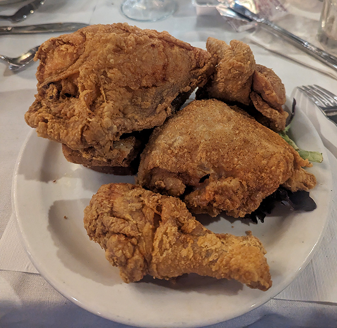 Fried chicken so perfectly golden, it makes Colonel Sanders look like he's still in basic training.