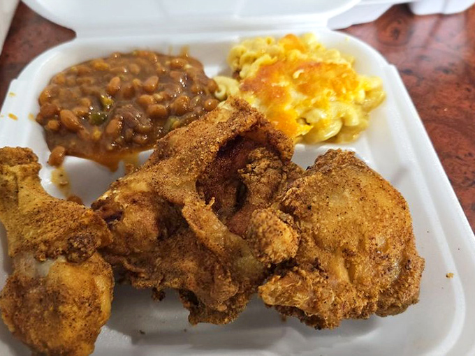 Fried chicken so perfectly executed it deserves its own trophy. That golden-brown crust is hiding juicy meat that's been seasoned all the way to the bone.