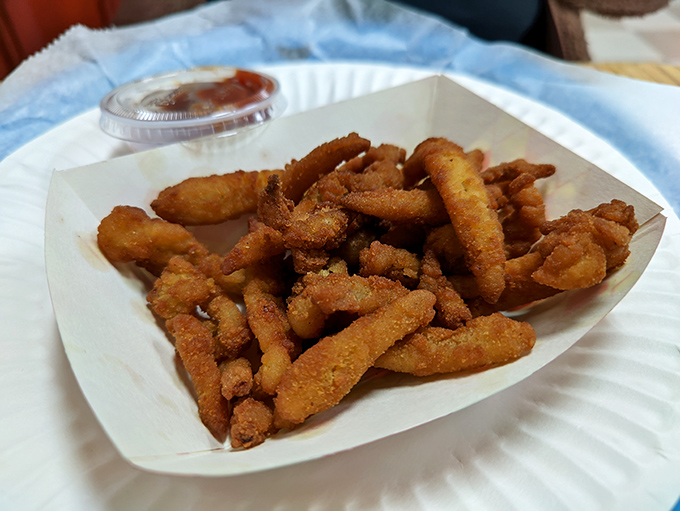 These golden-fried clams aren't just appetizers, they're little oceanic treasures that would make Neptune himself abandon his trident for a plastic fork.