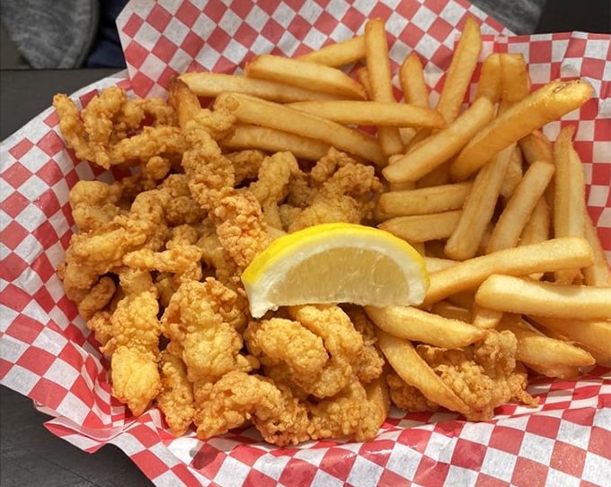 Golden-fried clams nestled alongside crispy fries&mdash;proof that sometimes the simplest pleasures deliver the most profound satisfaction.