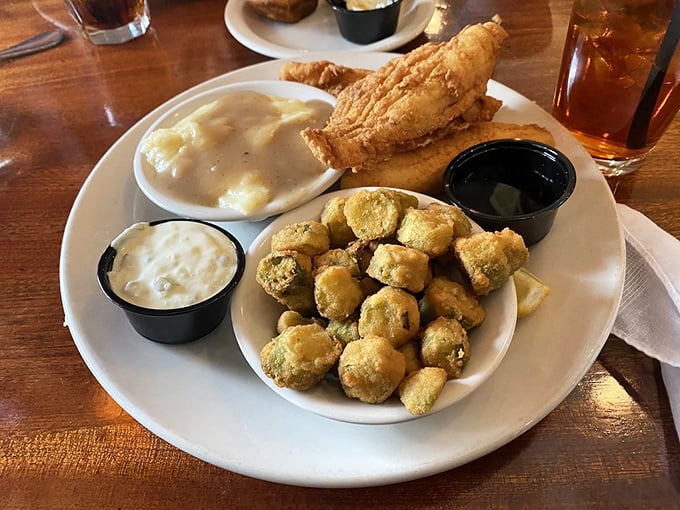 Fried flounder and mushrooms sharing a plate like old friends at a reunion. The tartar sauce is just there to keep the peace.