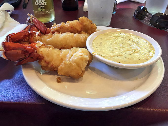 Lobster tails that look like they're wearing golden evening gowns, accompanied by a dipping sauce that deserves its own fan club.