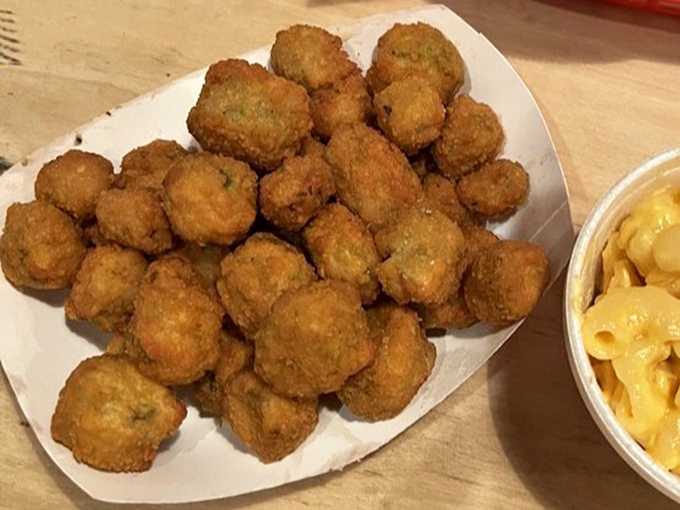 Golden-fried okra nuggets that crunch like nature's popcorn—the perfect Southern sidekick to tame the barbecue beast.